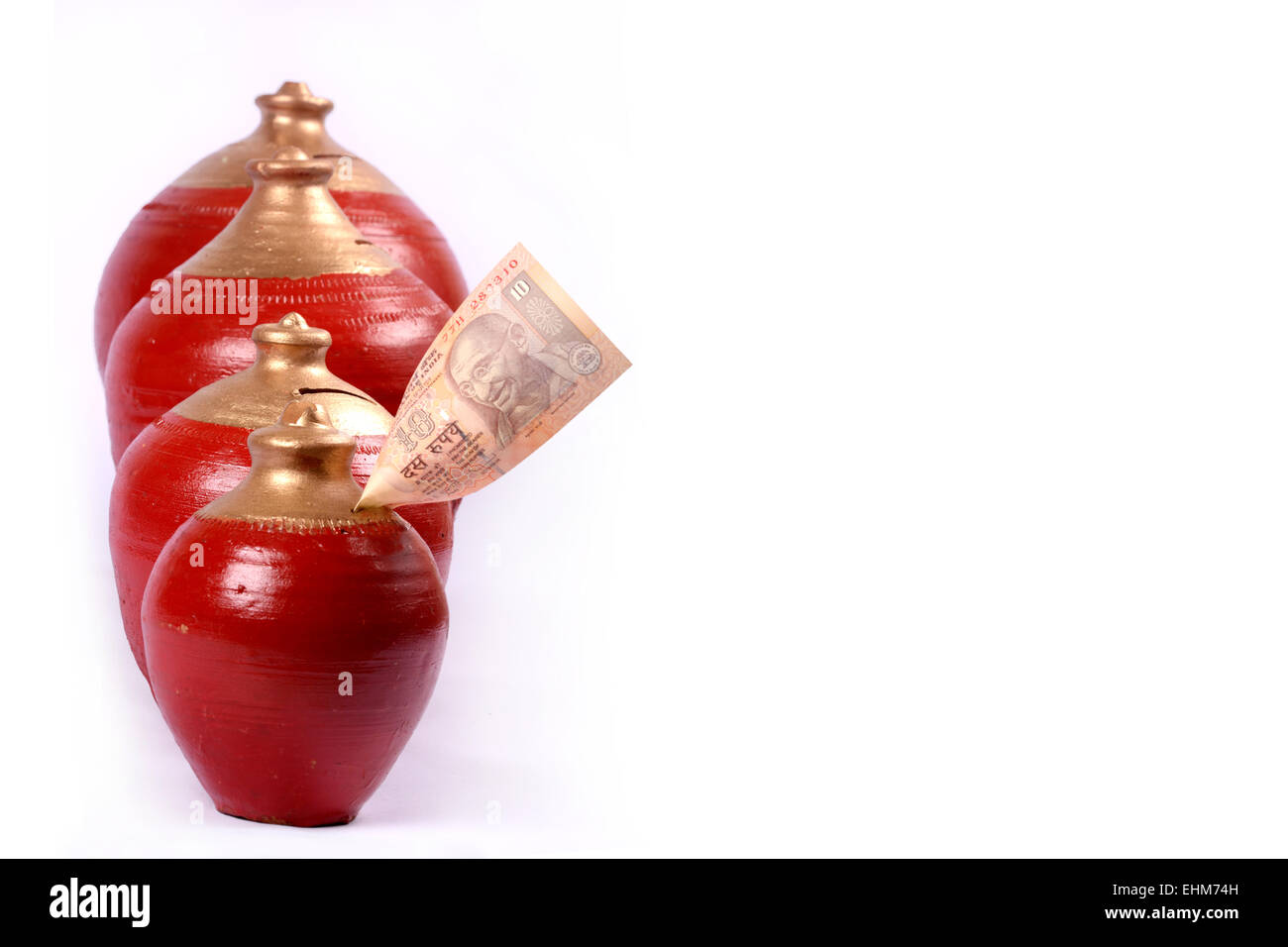 Earthen pot is a coin box of rural India called Gullak Stock Photo - Alamy
