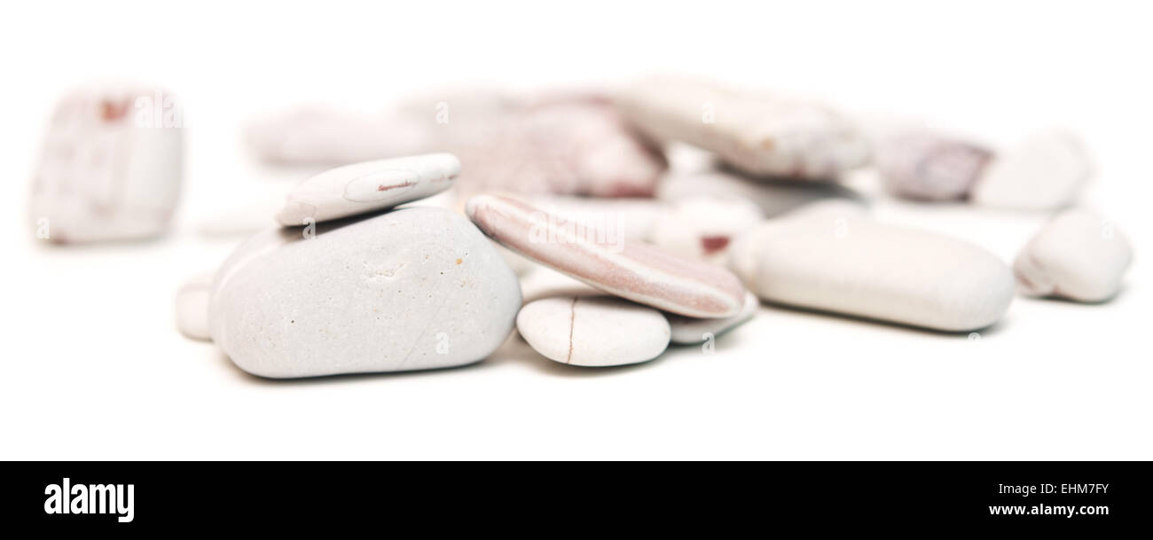 pile of sea smooth stones isolated on white Stock Photo - Alamy