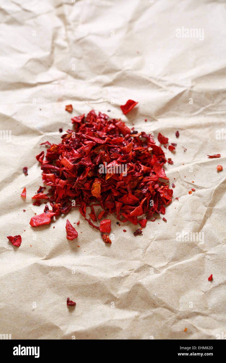 Paprika on kraft paper, spices Stock Photo - Alamy