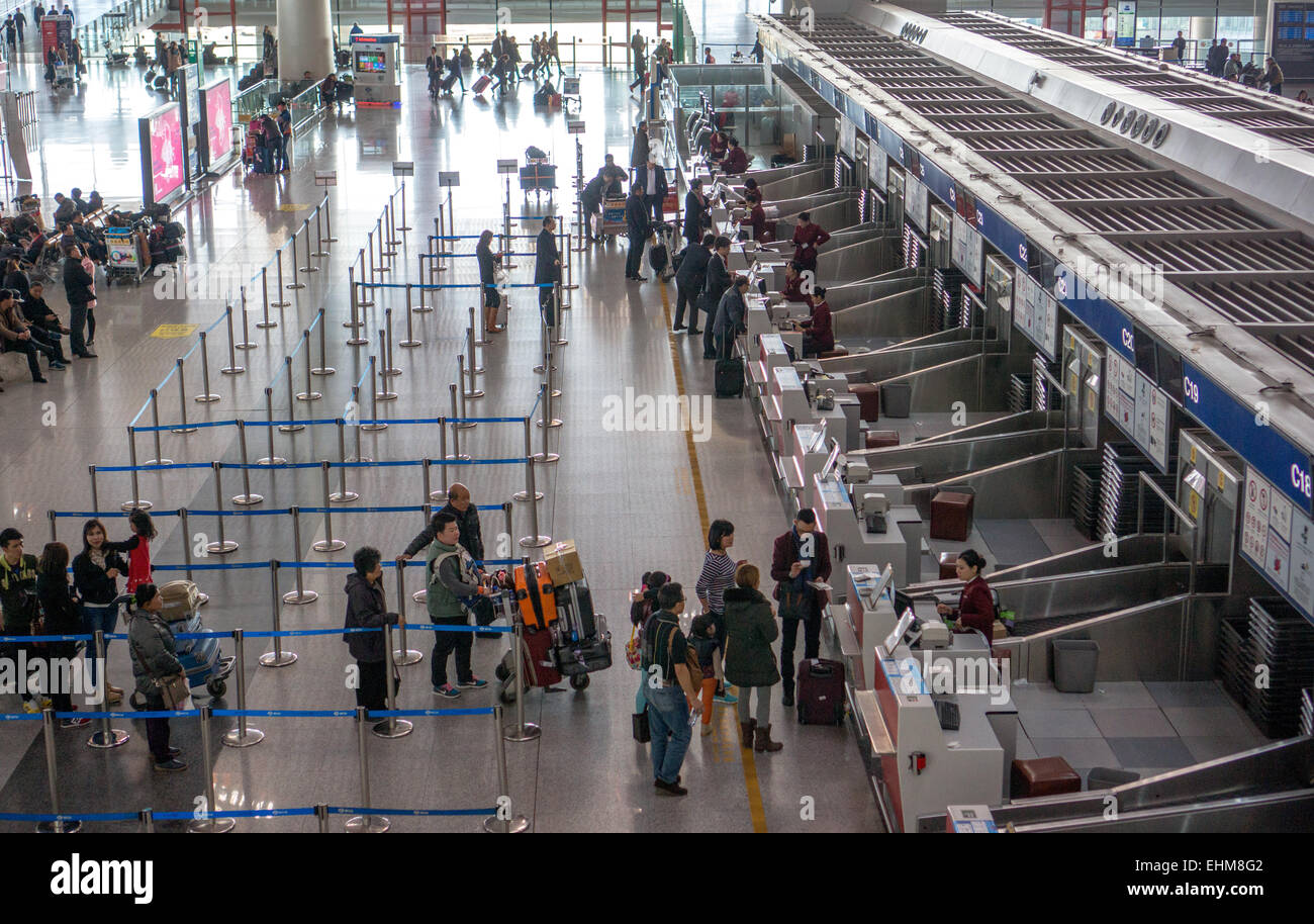 check-in counters in Beijing international airport terminal 3 Stock Photo - Alamy