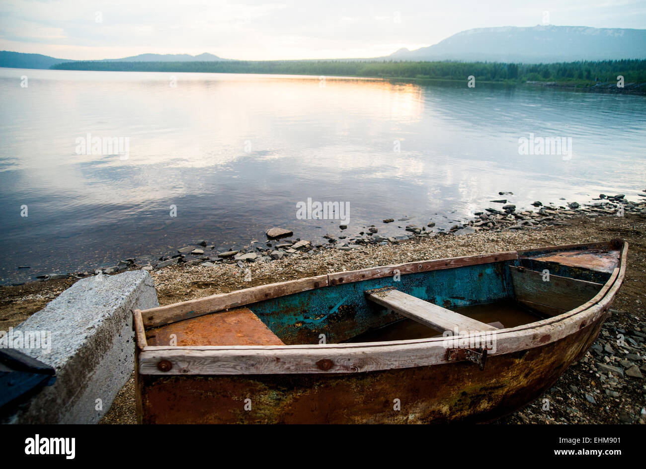 Dilapidated boat at rural lake Stock Photo - Alamy