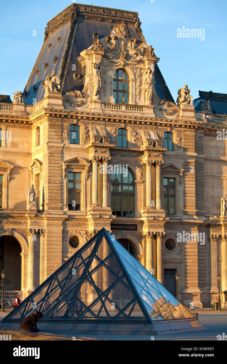 The Louvre Palace and Pyramid before sunset, Paris, France Stock Photo ...