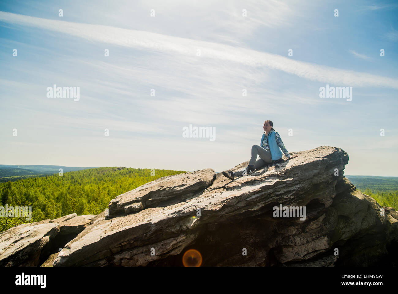 Caucasian climber sitting on rock formation Stock Photo - Alamy