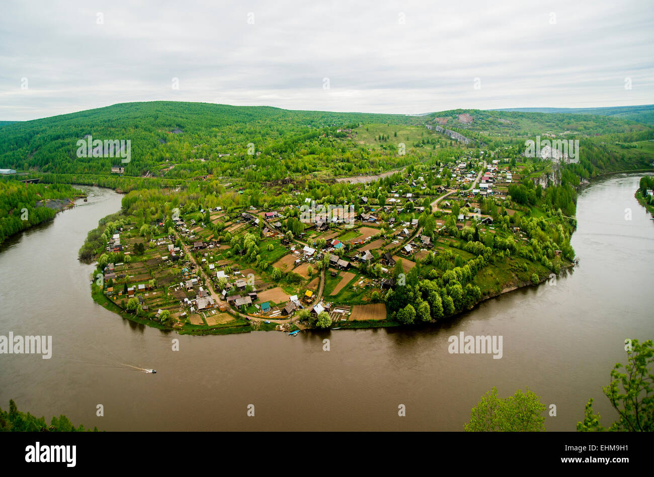 Aerial view of village near bend in river Stock Photo - Alamy