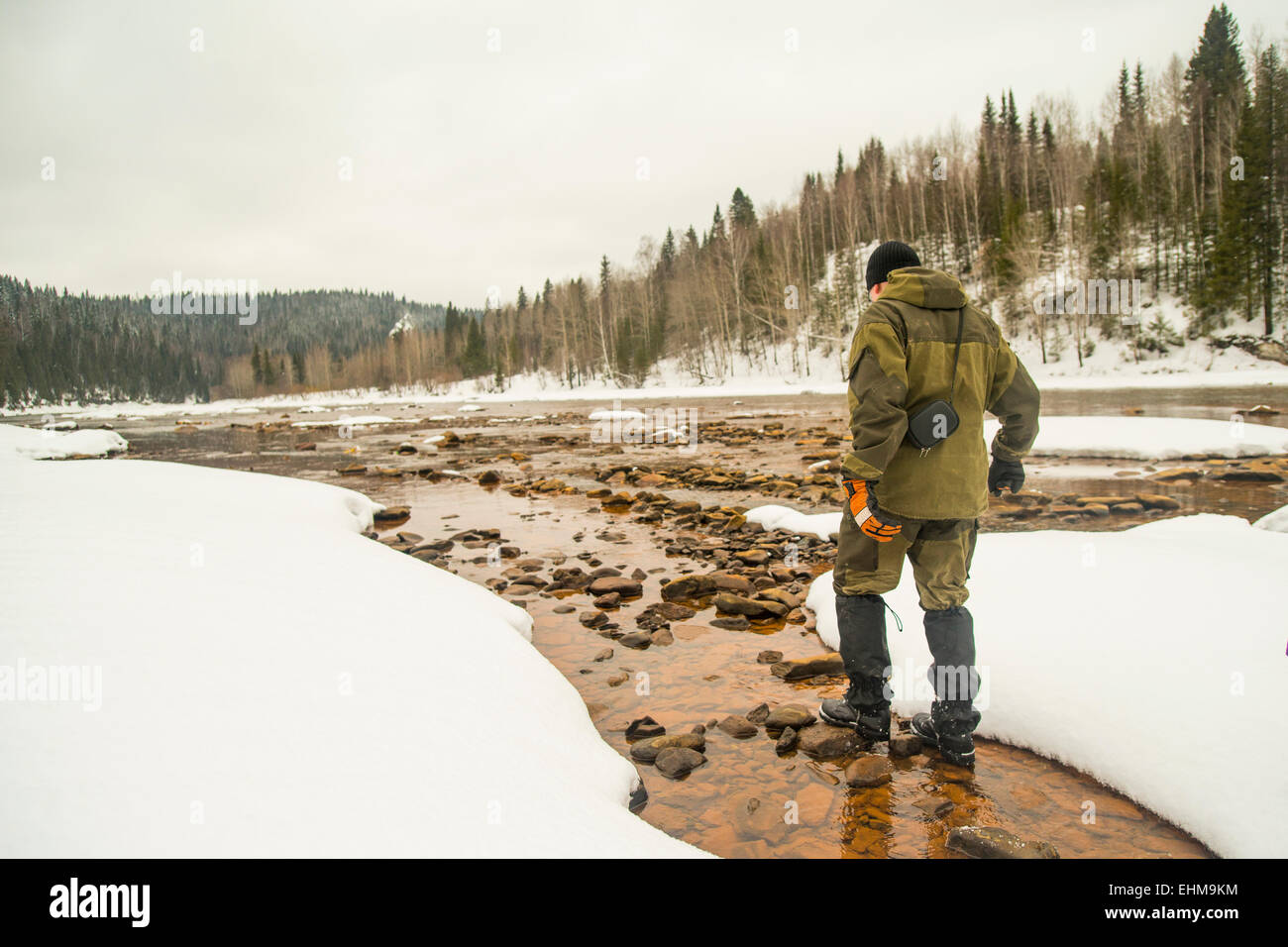 Caucasian hiker walking in rocky remote river Stock Photo - Alamy