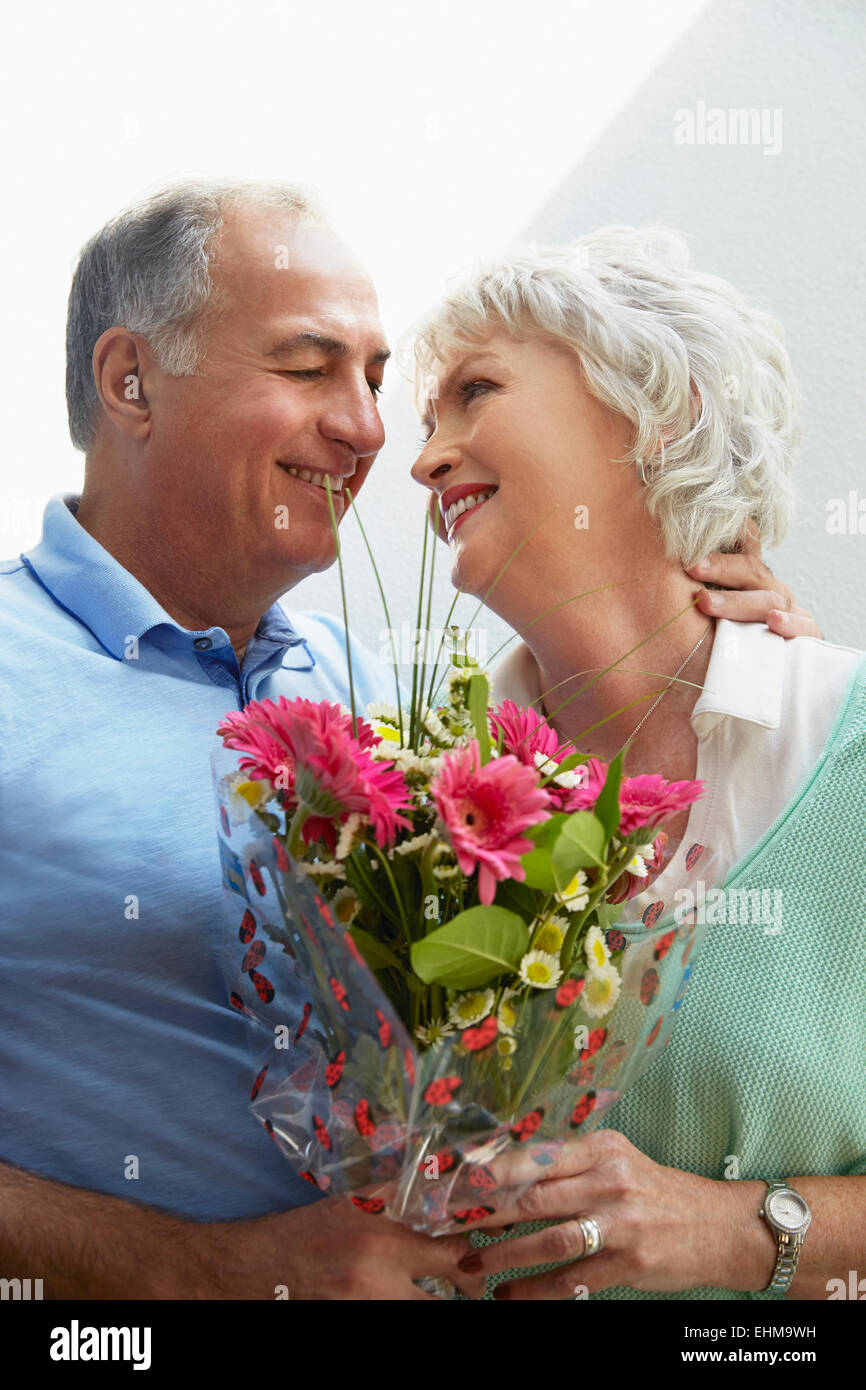Portrait happy couple holding flower hi-res stock photography and ...