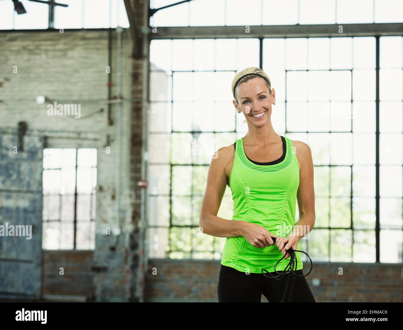 Woman standing holding rope hi-res stock photography and images - Alamy