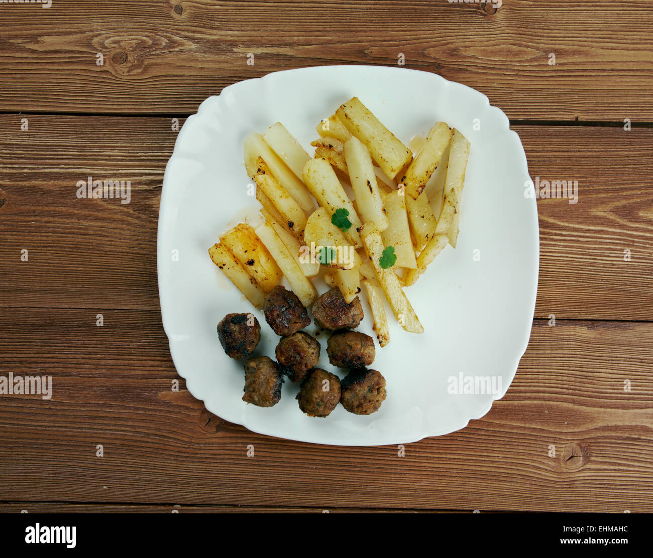 Boulet a la liegeoise - meatballs with sauce and french fries Stock ...