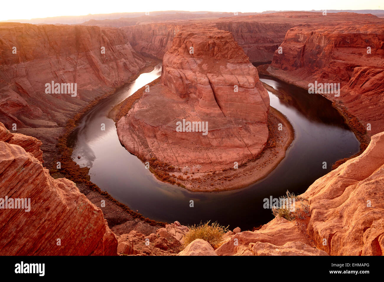 Horse shoe bend in river near majestic rock formations in desert ...