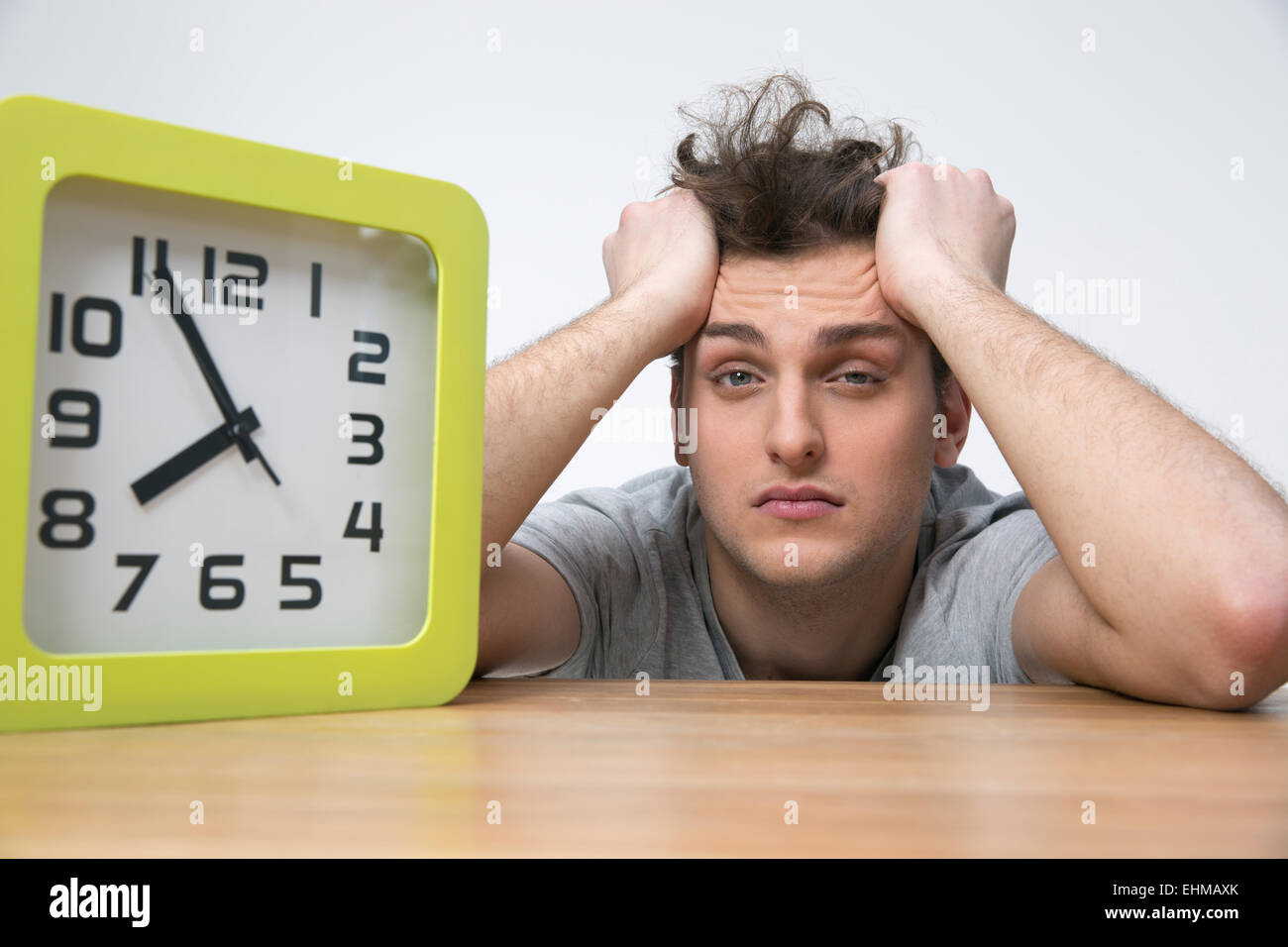 Young man clock morning hi-res stock photography and images - Alamy