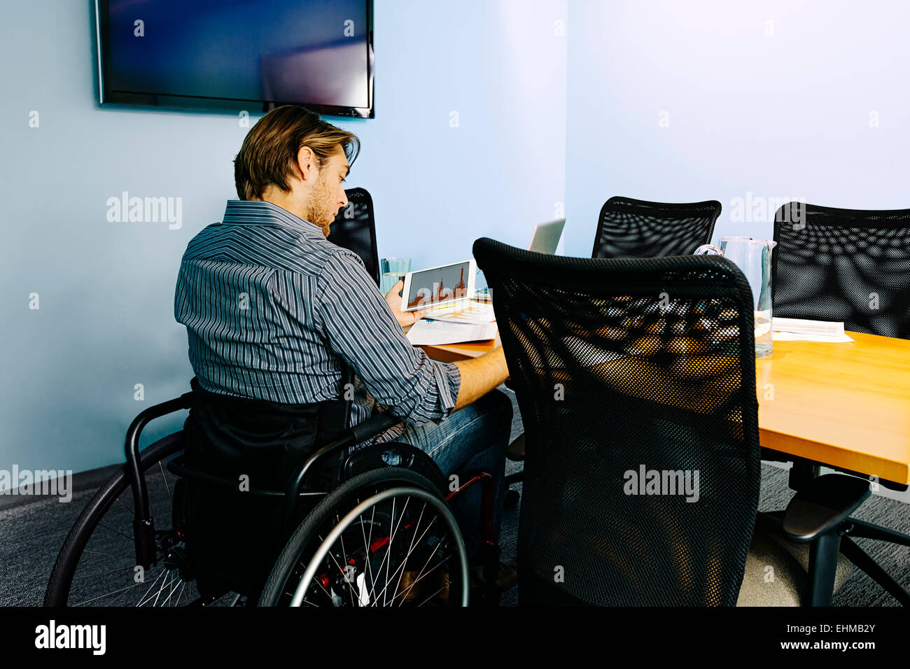 Businessman in wheelchair working desk hi-res stock photography and ...