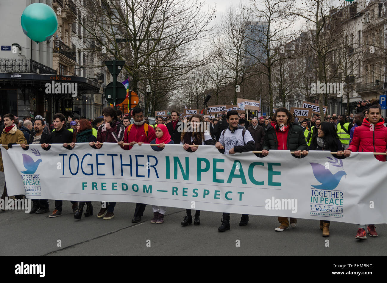 People hold a banner what reads “Together In Peace ,Freedom – Respect ...
