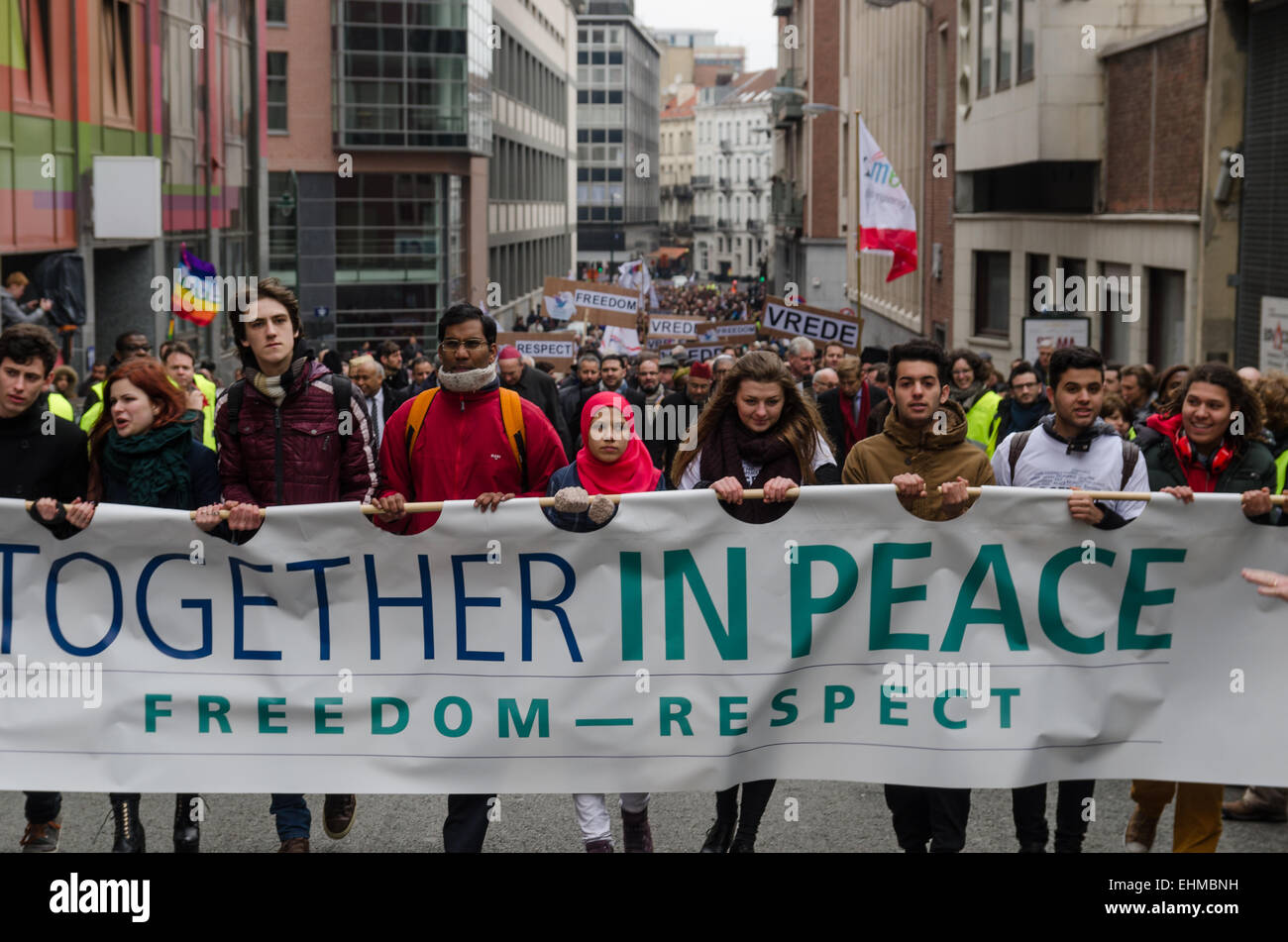 People hold a banner what reads “Together In Peace ,Freedom – Respect ...