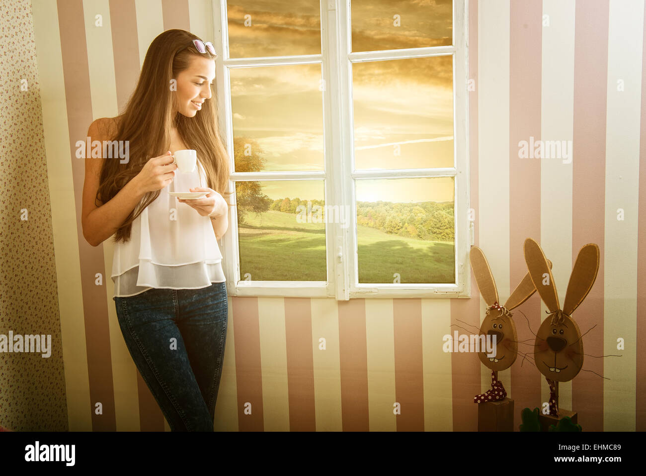 Woman drinking coffee in a beautiful morning in the window Stock Photo ...