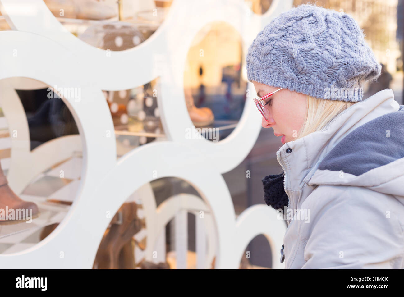 Woman window shopping Stock Photo - Alamy