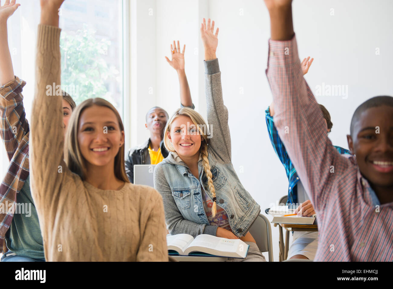 African american girl raising hand hi-res stock photography and images ...