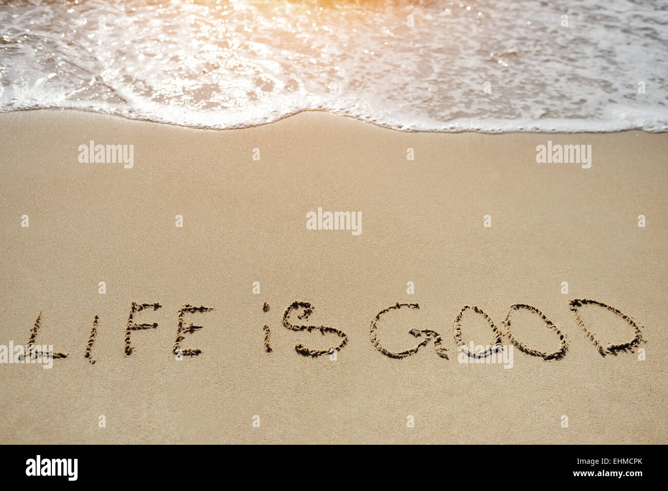 life in good written on sand beach - positive thinking concept Stock ...