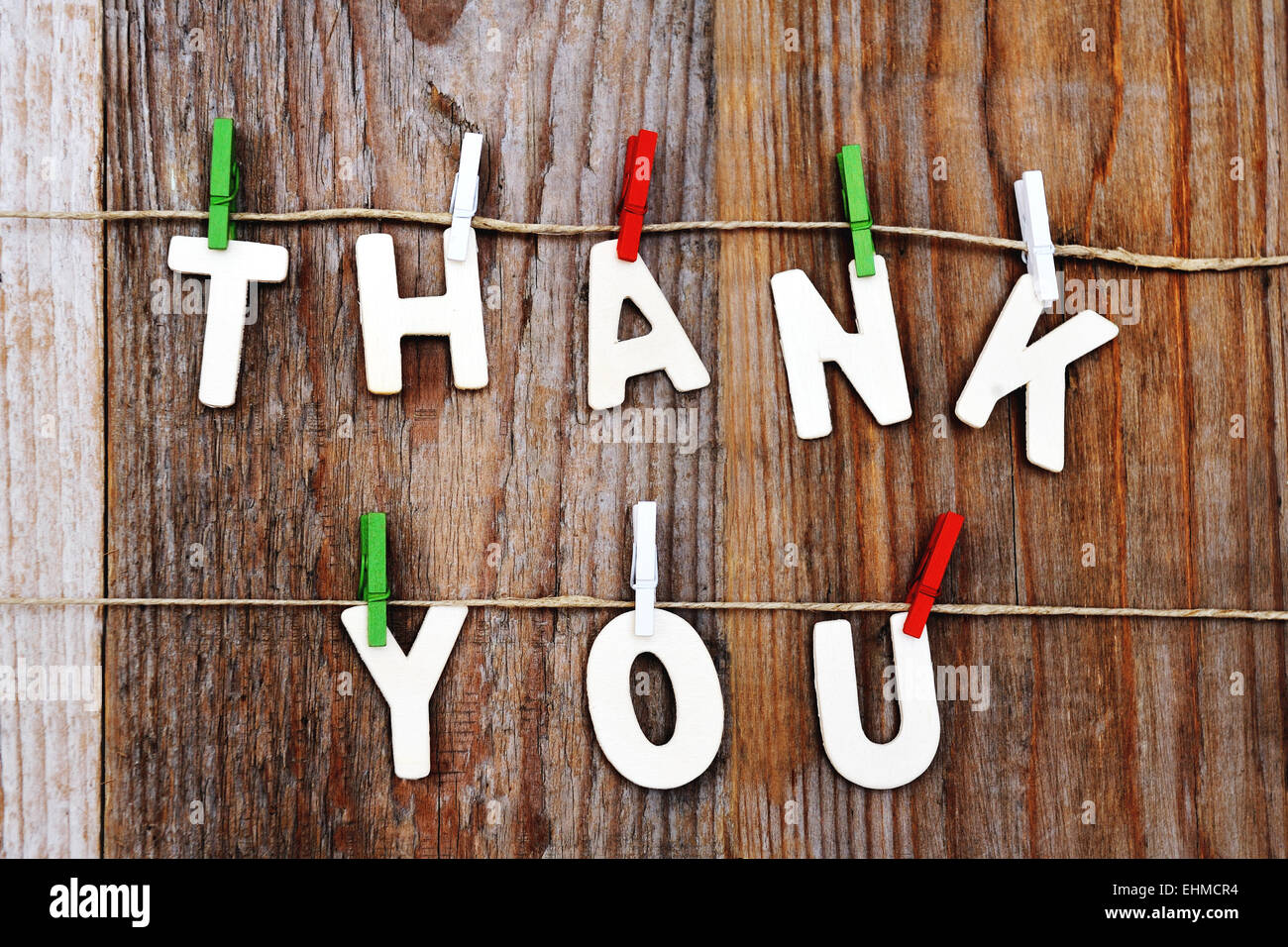 thank you words on brown wooden background Stock Photo - Alamy