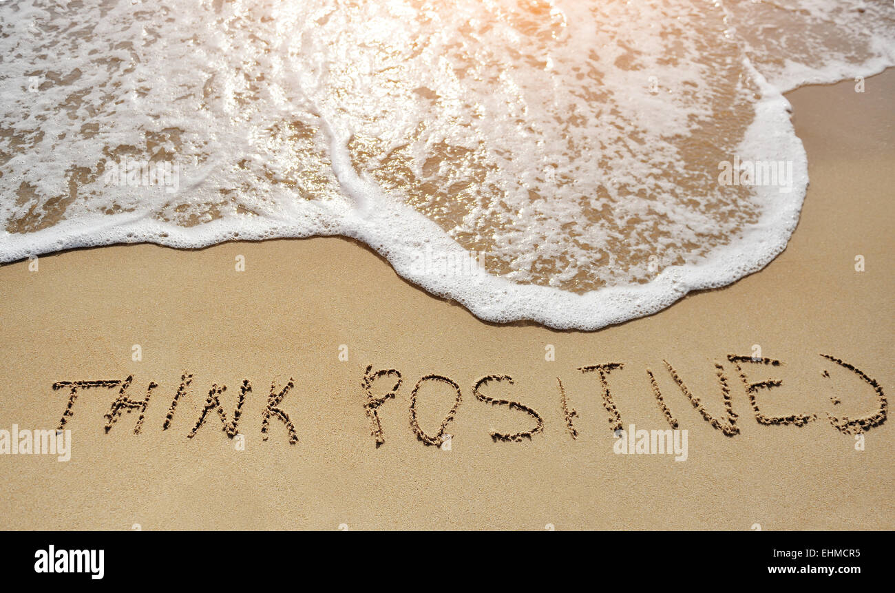 think positive written on sand beach - positive thinking concept Stock ...