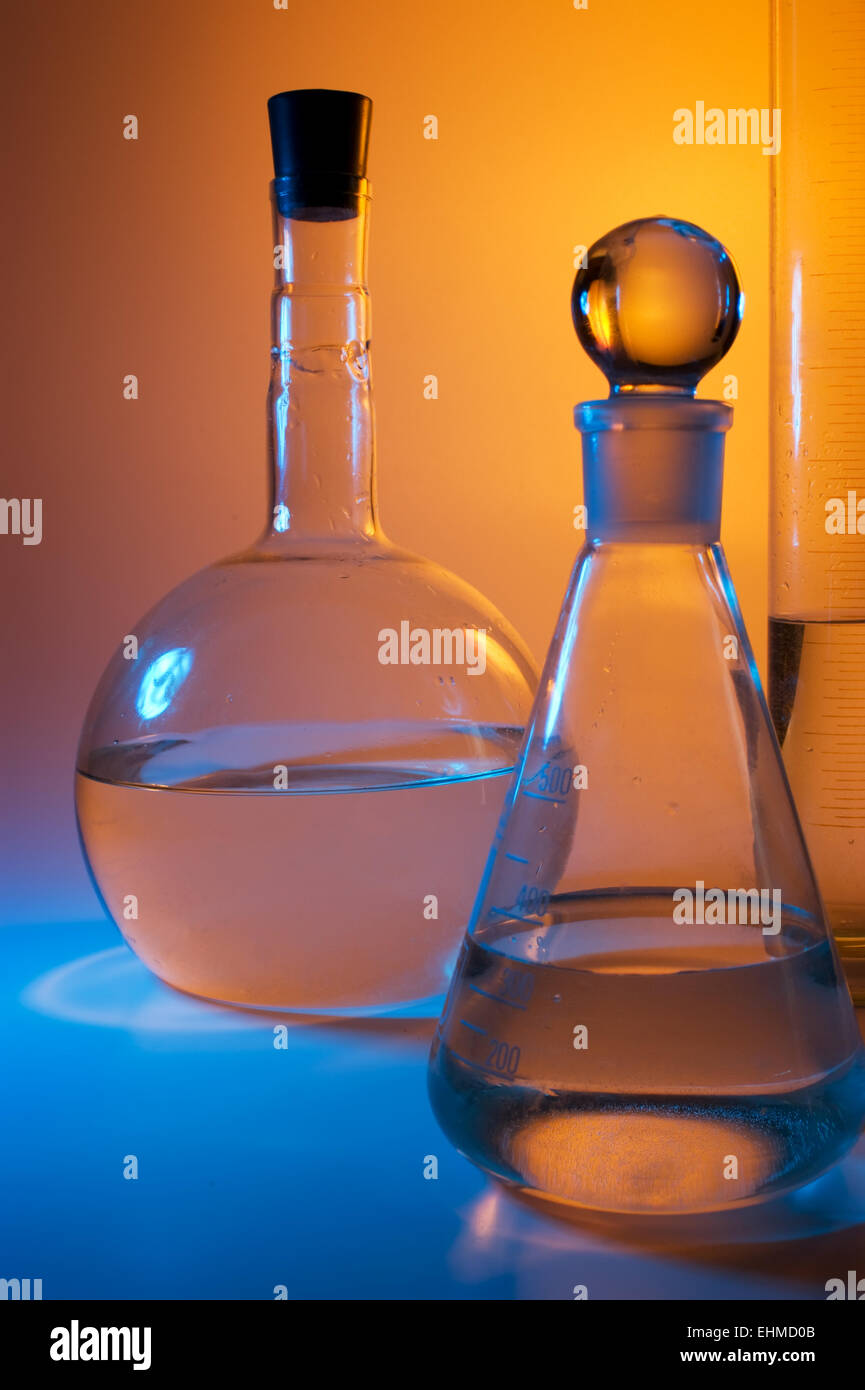 chemical glassware in multicolored lights Stock Photo - Alamy