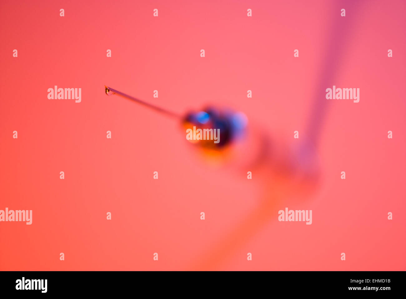 old glass syringe multicolored lights Stock Photo - Alamy