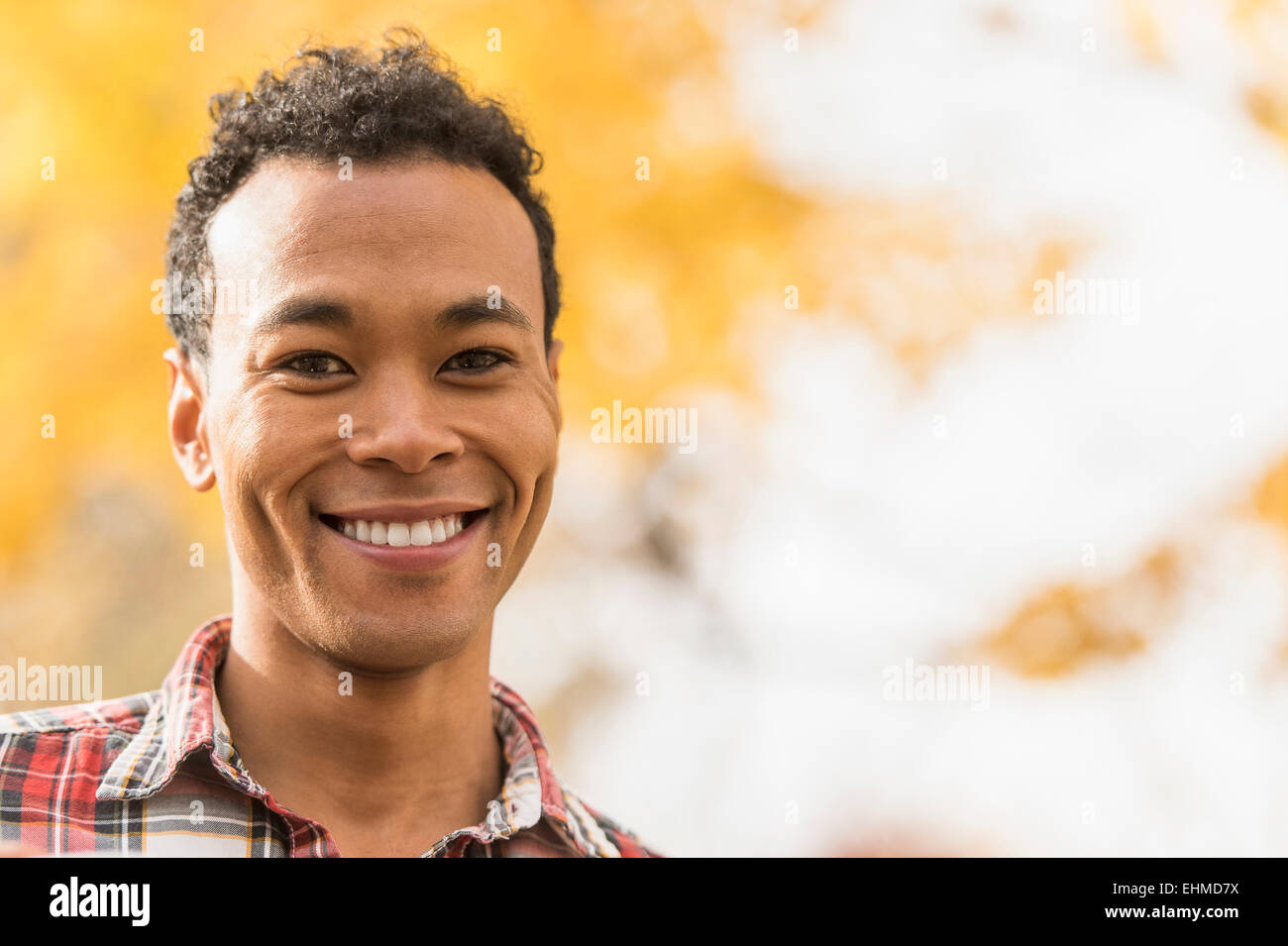 Mixed race man smiling outdoors Stock Photo - Alamy
