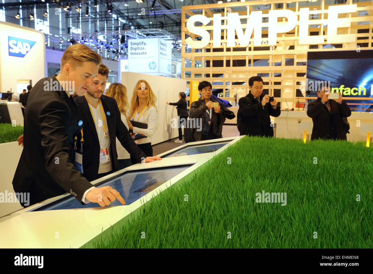 Digital farming with a real wheat field on the stand of SAP software company at the CeBIT ...