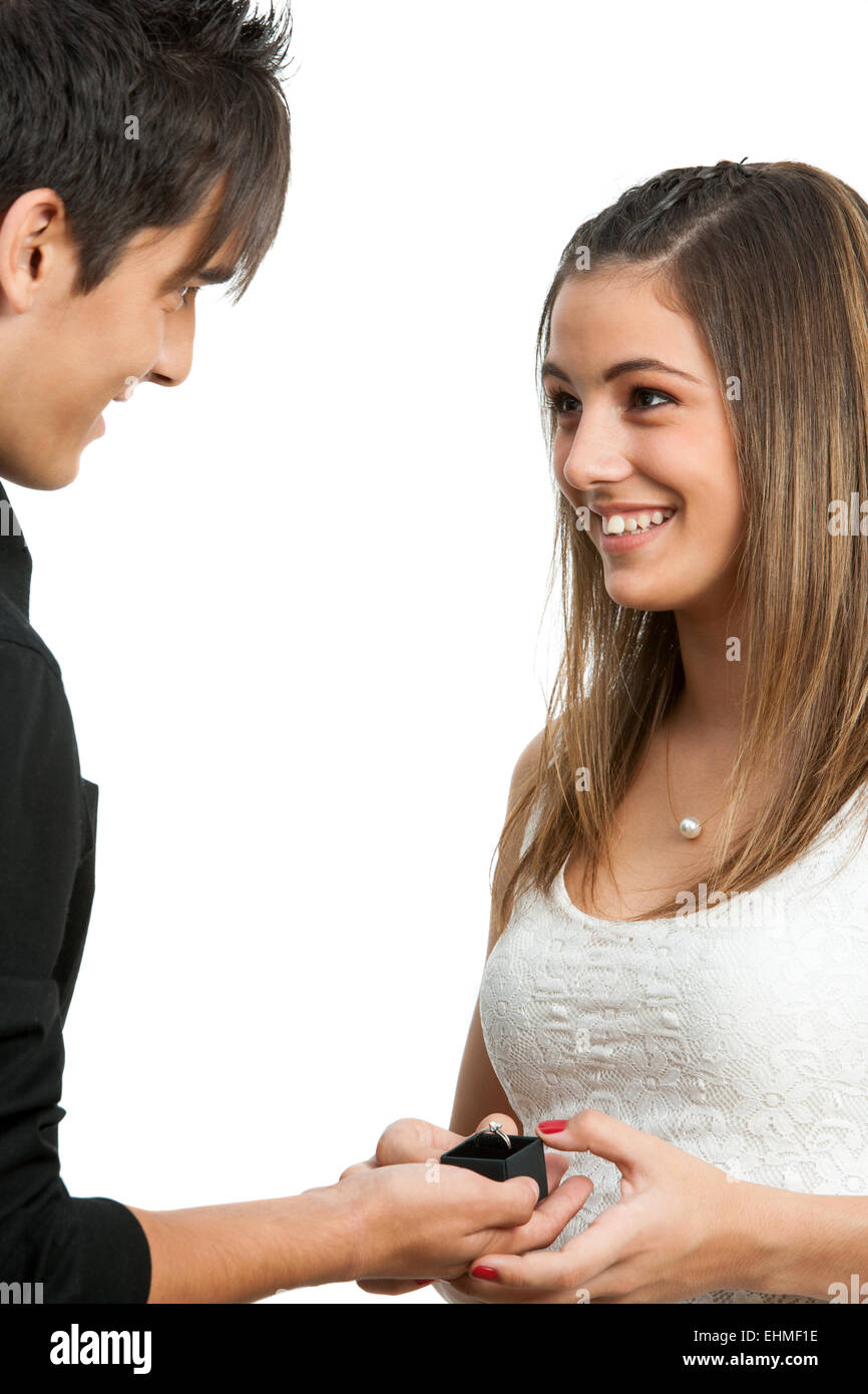 Close up of cute girl receiving diamond ring.Isolated on white Stock ...