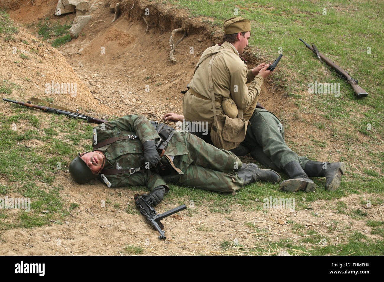 Re-enactors dressed as Soviet and Nazi soldiers attend a re-enactment ...