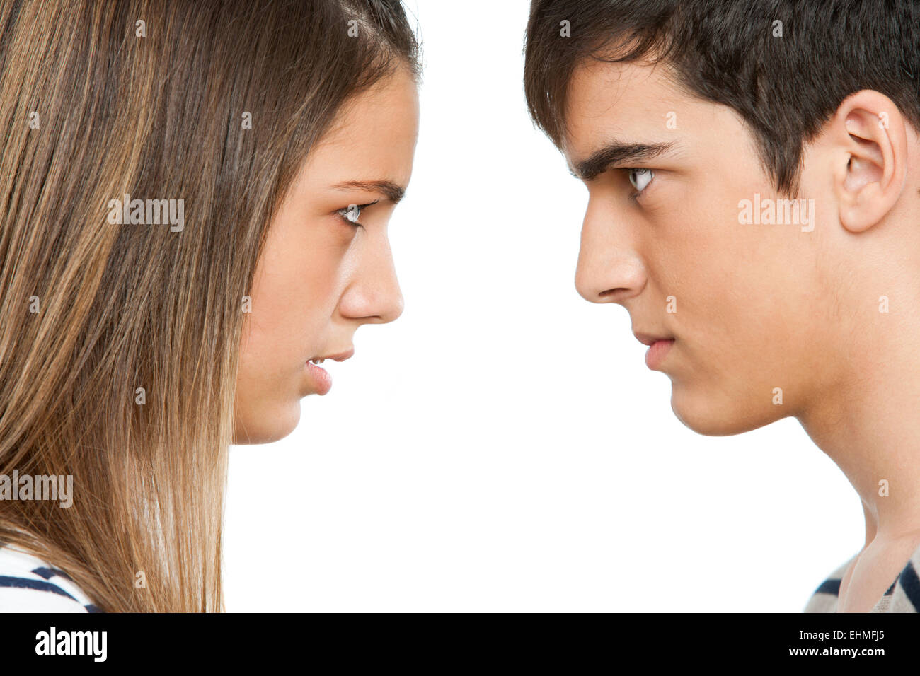 Close up portrait of teen couple with angry face expression.Isolated ...