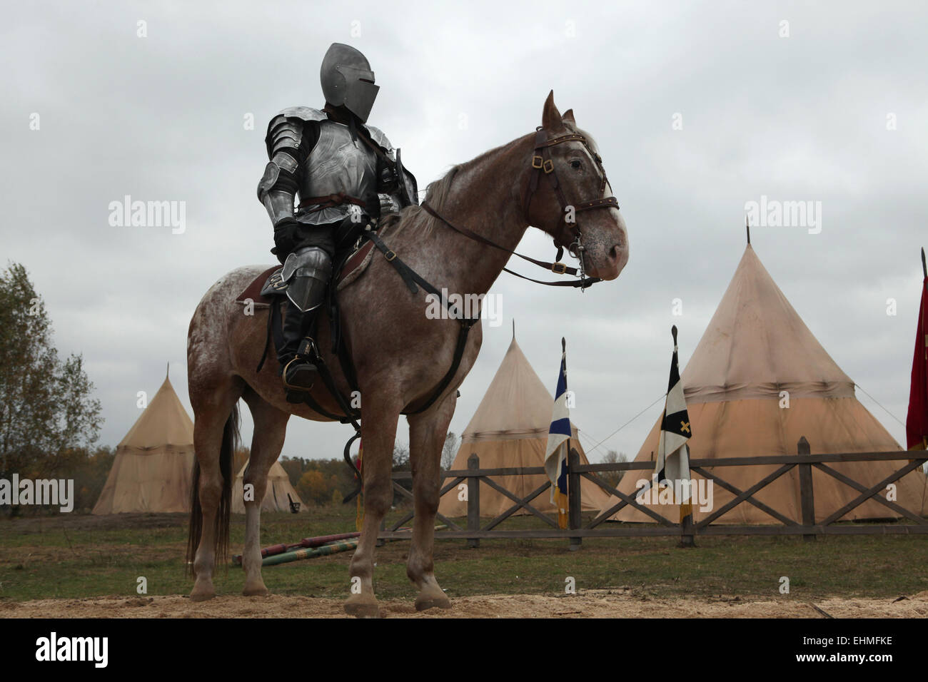 Actor dressed as a medieval knight rides a horse during the filming of ...