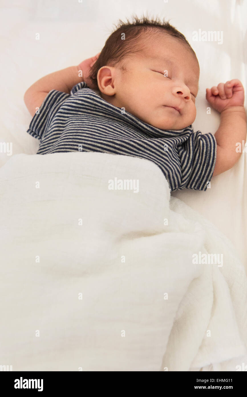 Black baby sleeping on bed hi-res stock photography and images - Alamy