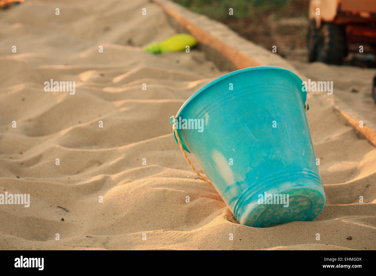 Blue bucket in sandpit Stock Photo - Alamy