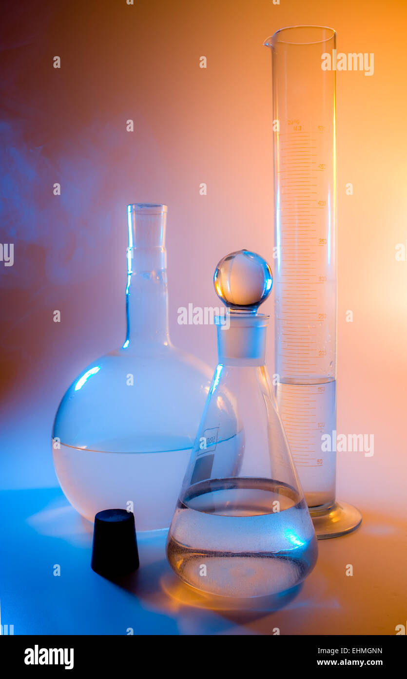 chemical glassware in multicolored lights Stock Photo - Alamy