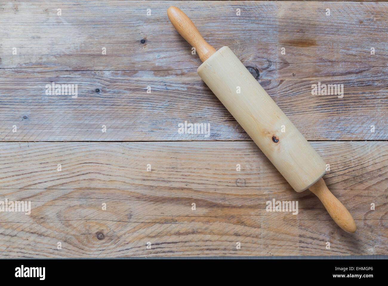 Rolling pin on a rustic wooden background Stock Photo - Alamy