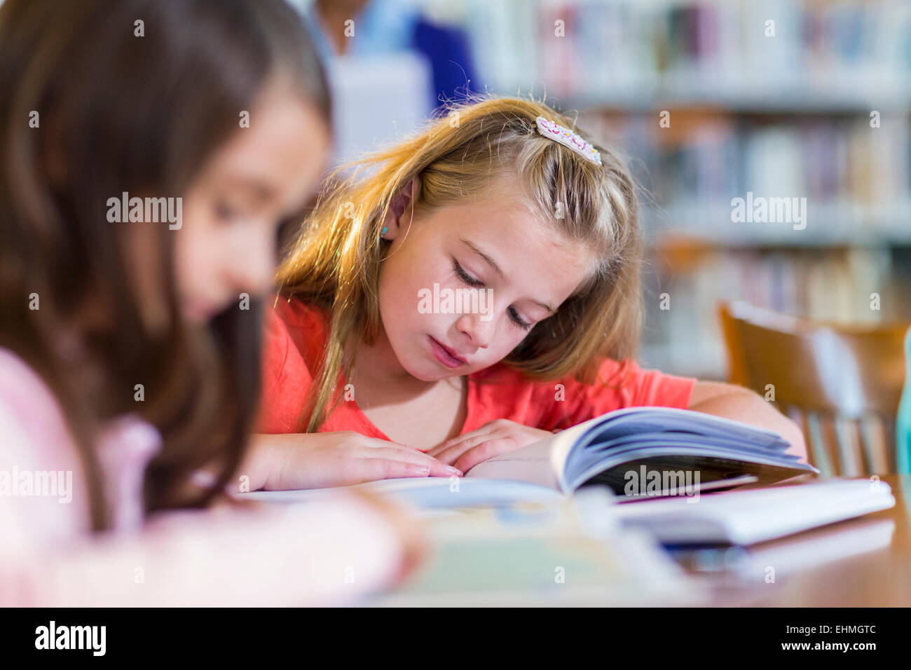 Students reading books in library Stock Photo - Alamy
