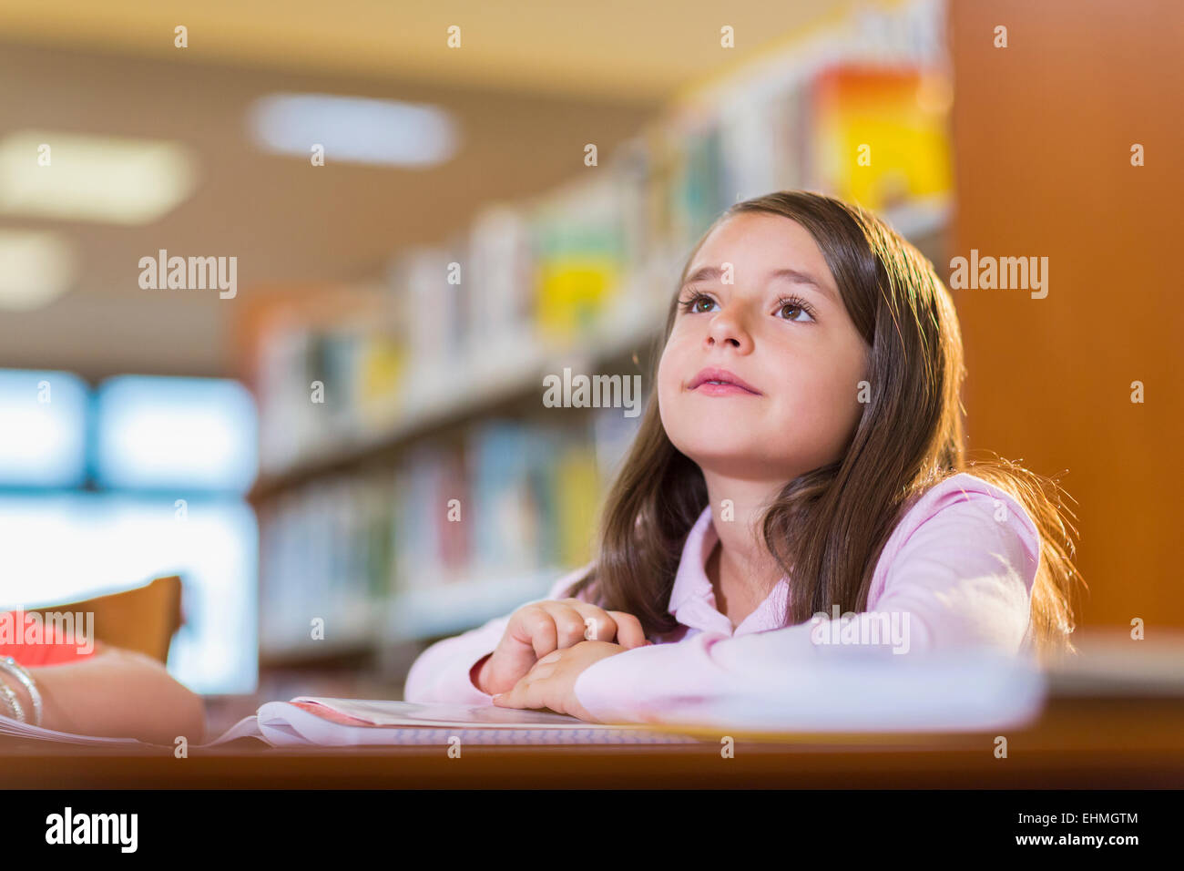 Girl sitting in library studying hi-res stock photography and images ...