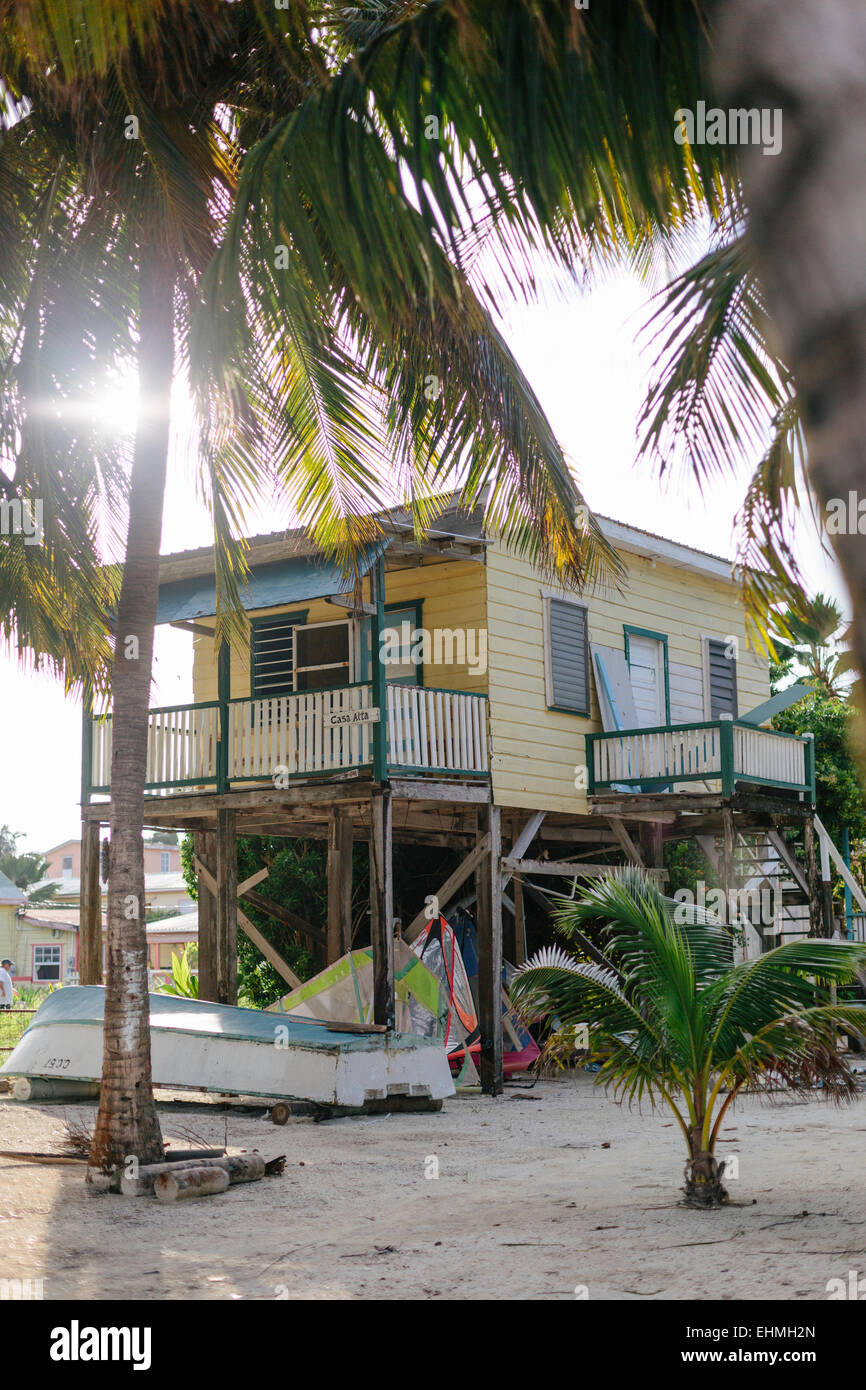 Yello stilted Beach Hut on Caye Caulker, Belize Stock Photo - Alamy