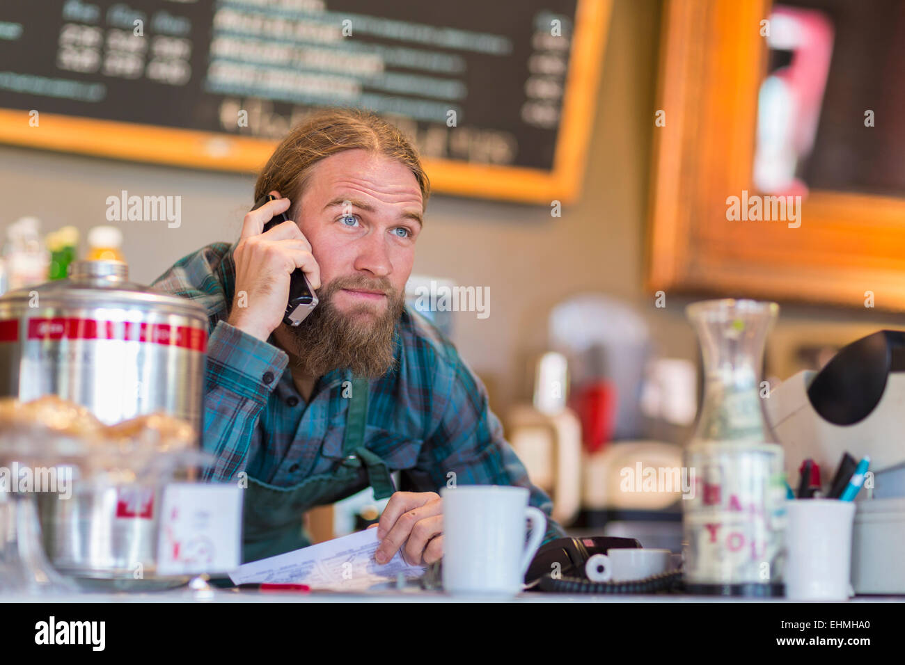 Cafe owner talking to customer hi-res stock photography and images - Alamy