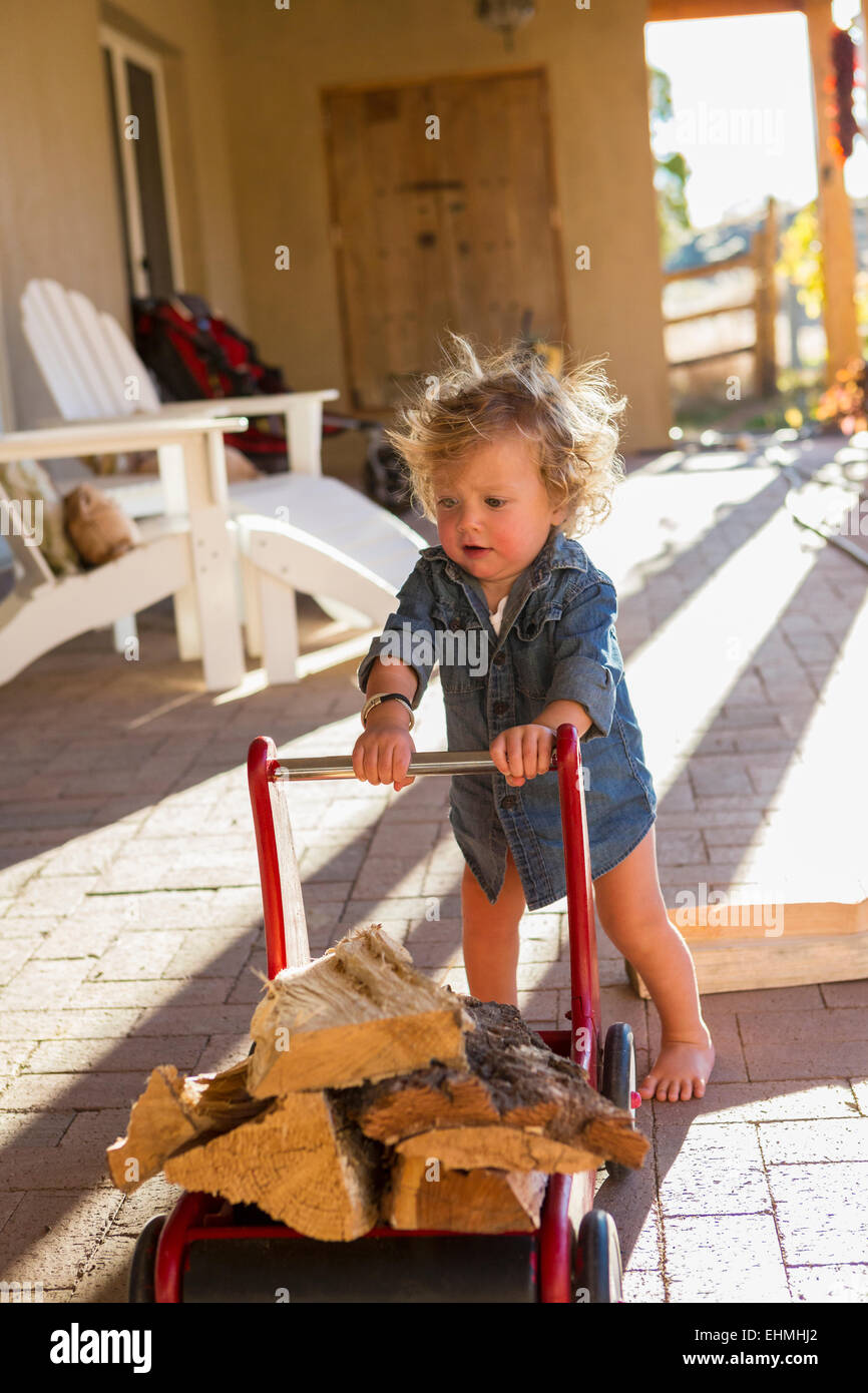 Boys pushing cart hi-res stock photography and images - Alamy