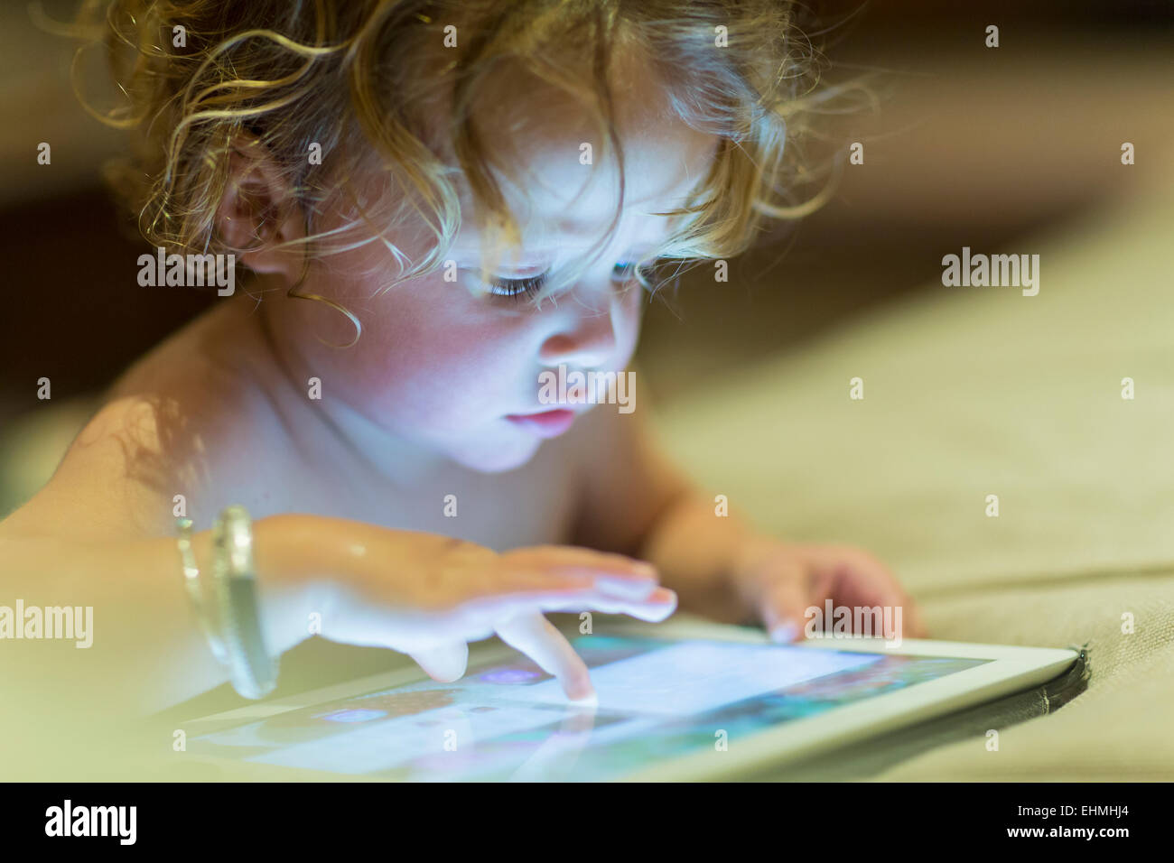 Caucasian baby using digital tablet Stock Photo - Alamy