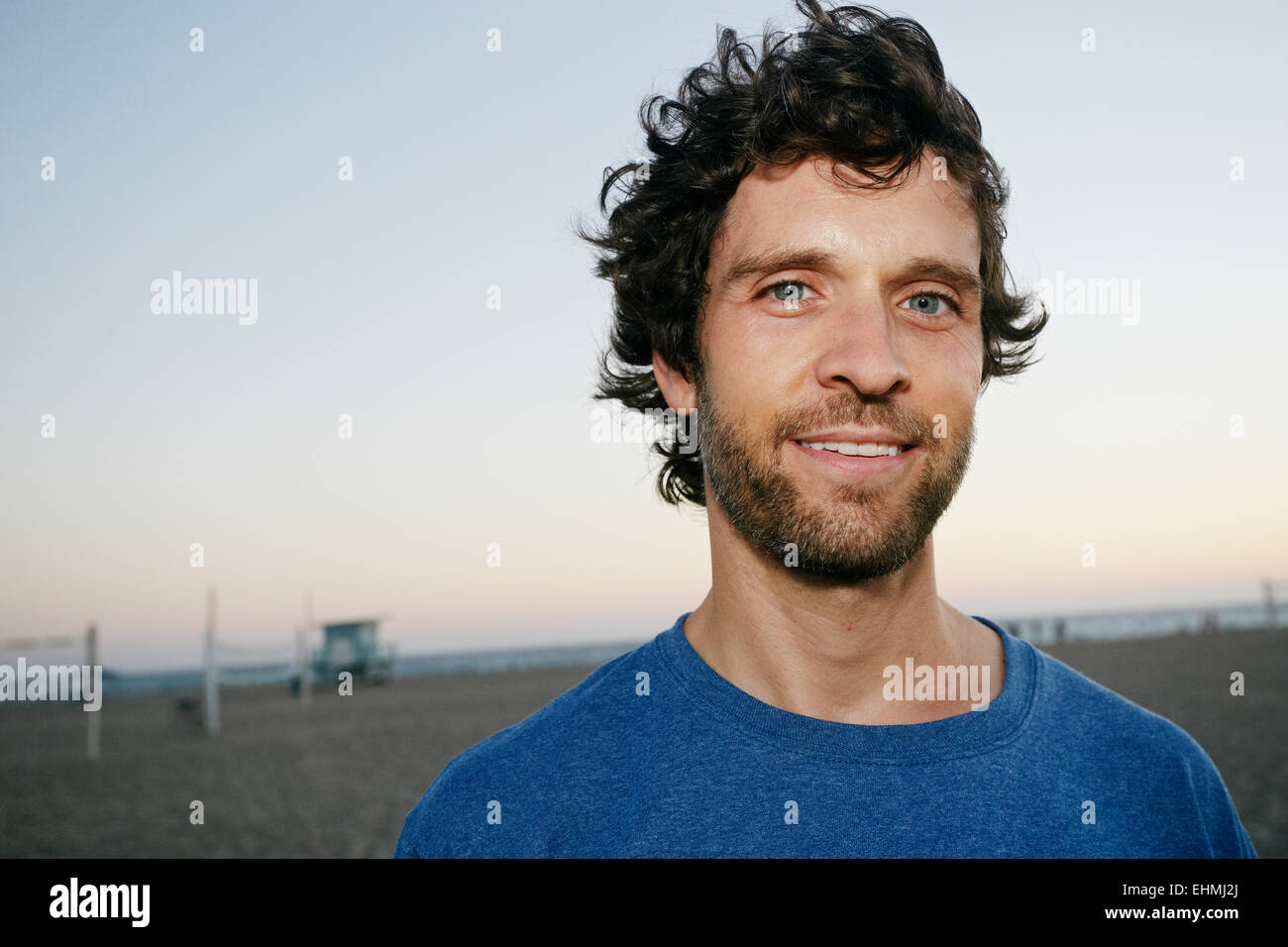 Men posing one the beach hi-res stock photography and images - Alamy