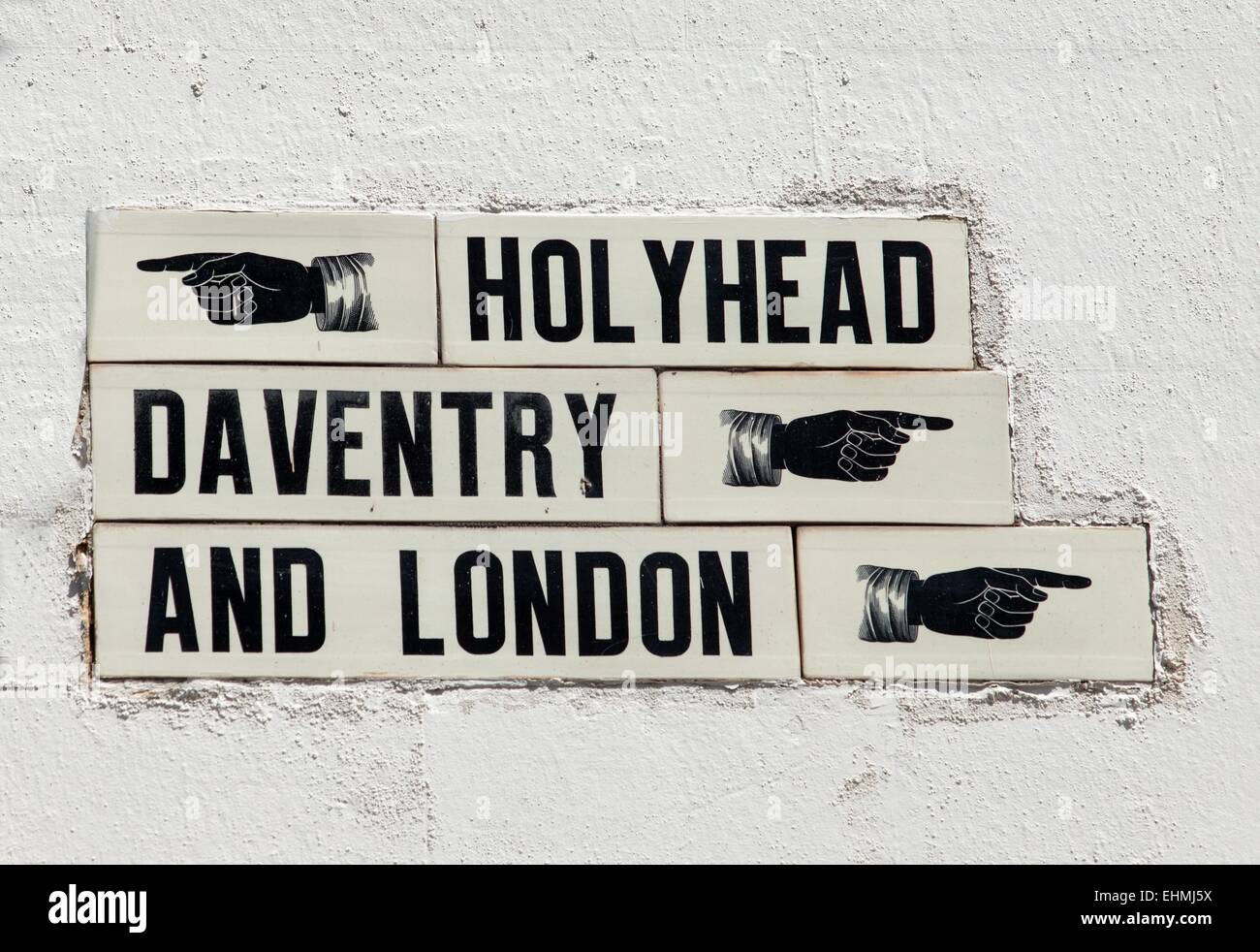 Old road sign in Atherstone, Warwickshire, UK, on the old A5 road Stock ...