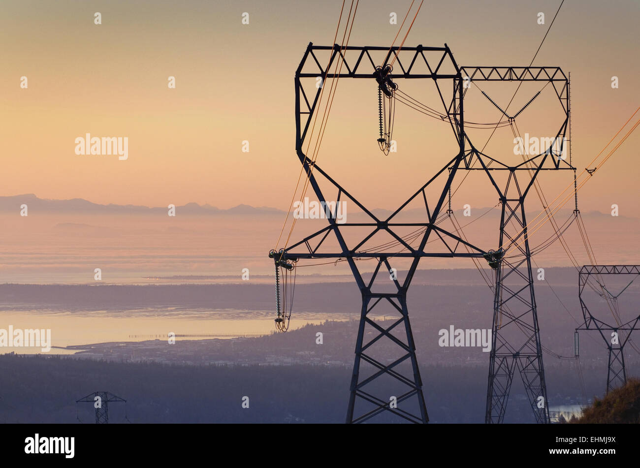 Silhouette of power lines at sunset Stock Photo - Alamy