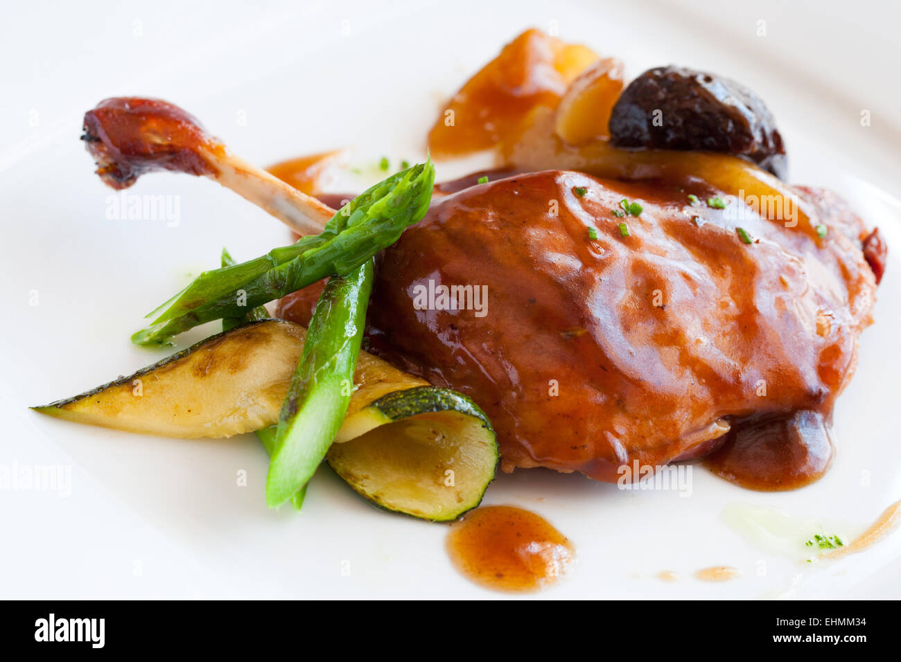 Close up of grilled duck thigh with sweet fruit dressing Stock Photo ...