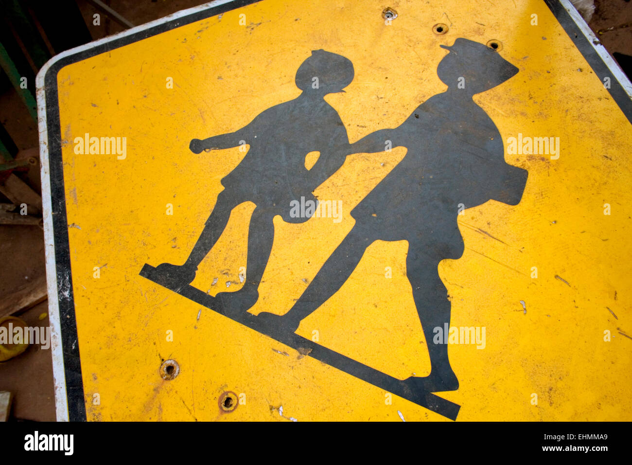 A school crossing sign showing children crossing rests on a cart in ...
