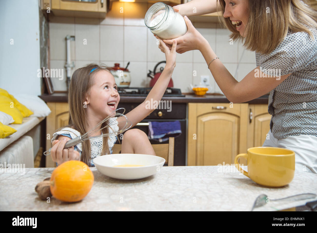 Small girl going to beat the dough for pancakes Stock Photo - Alamy