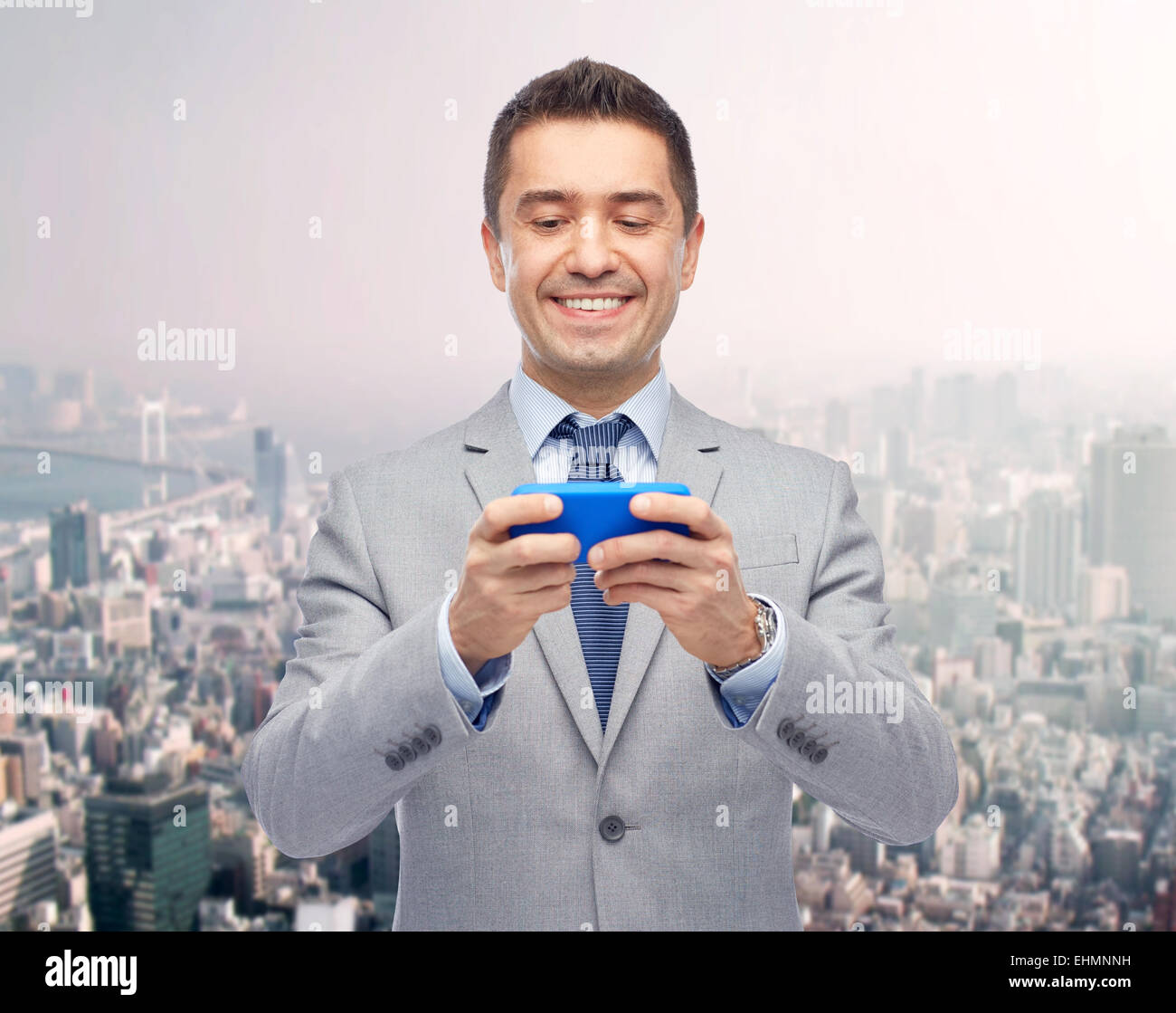 happy businessman texting on smartphone Stock Photo - Alamy