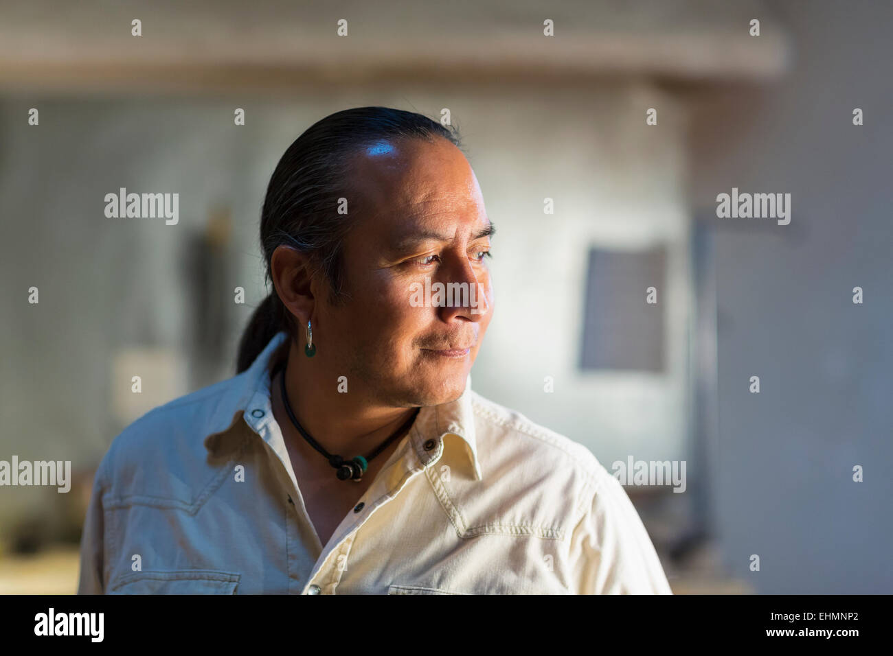 Native American man smiling indoors Stock Photo - Alamy