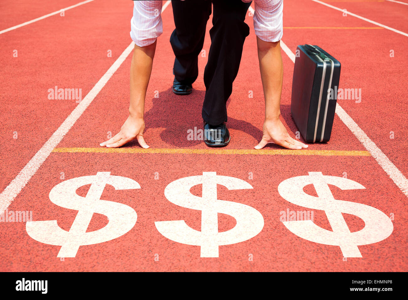 businessman getting ready for race on the track Stock Photo - Alamy